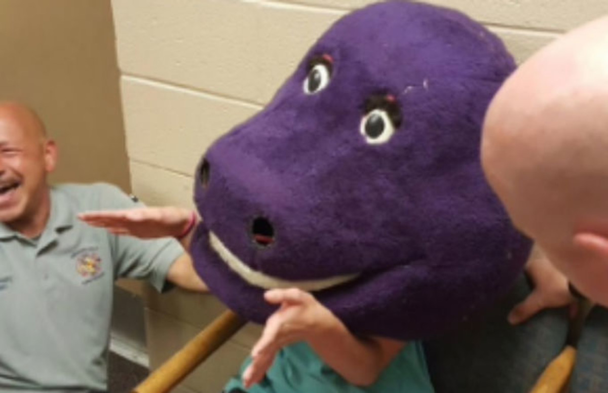Firefighters Perform Roaring Rescue of Teen Trapped in Giant Barney ...