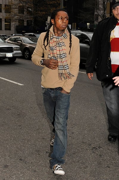Lil Wayne wearing a Burberry scarf, jeans, sweater, and shoes on his ...