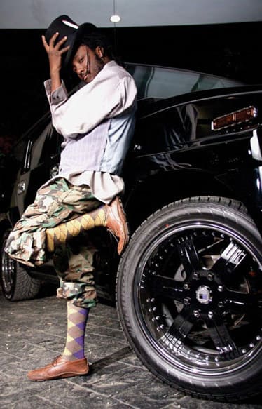 will.i.am - 30 Photos of Rappers Flexing With Giant Car Rims | Complex